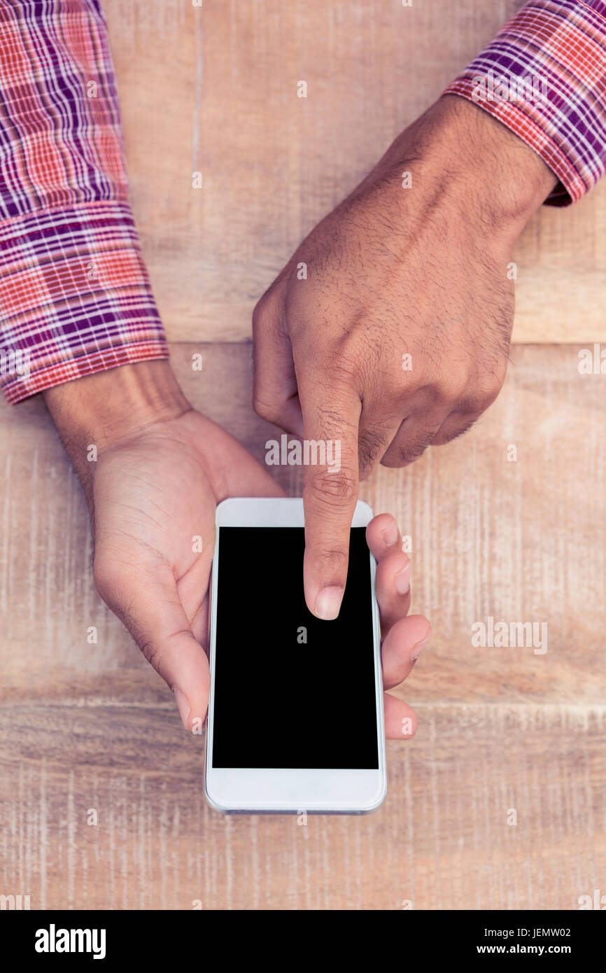 Man touching screen of phone Stock Photo - Alamy