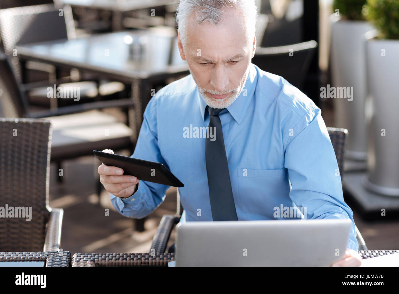 Attentive male executive using hi-res stock photography and images - Alamy