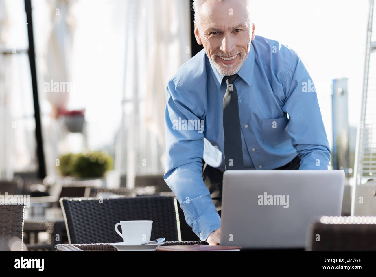 Man standing with laptop money hi-res stock photography and images - Alamy
