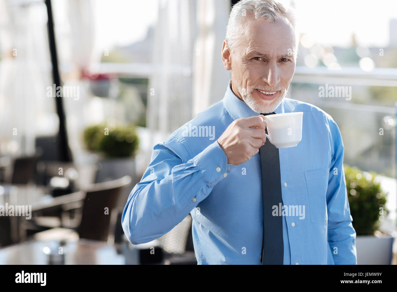 Fascinating man looking straight at camera Stock Photo - Alamy