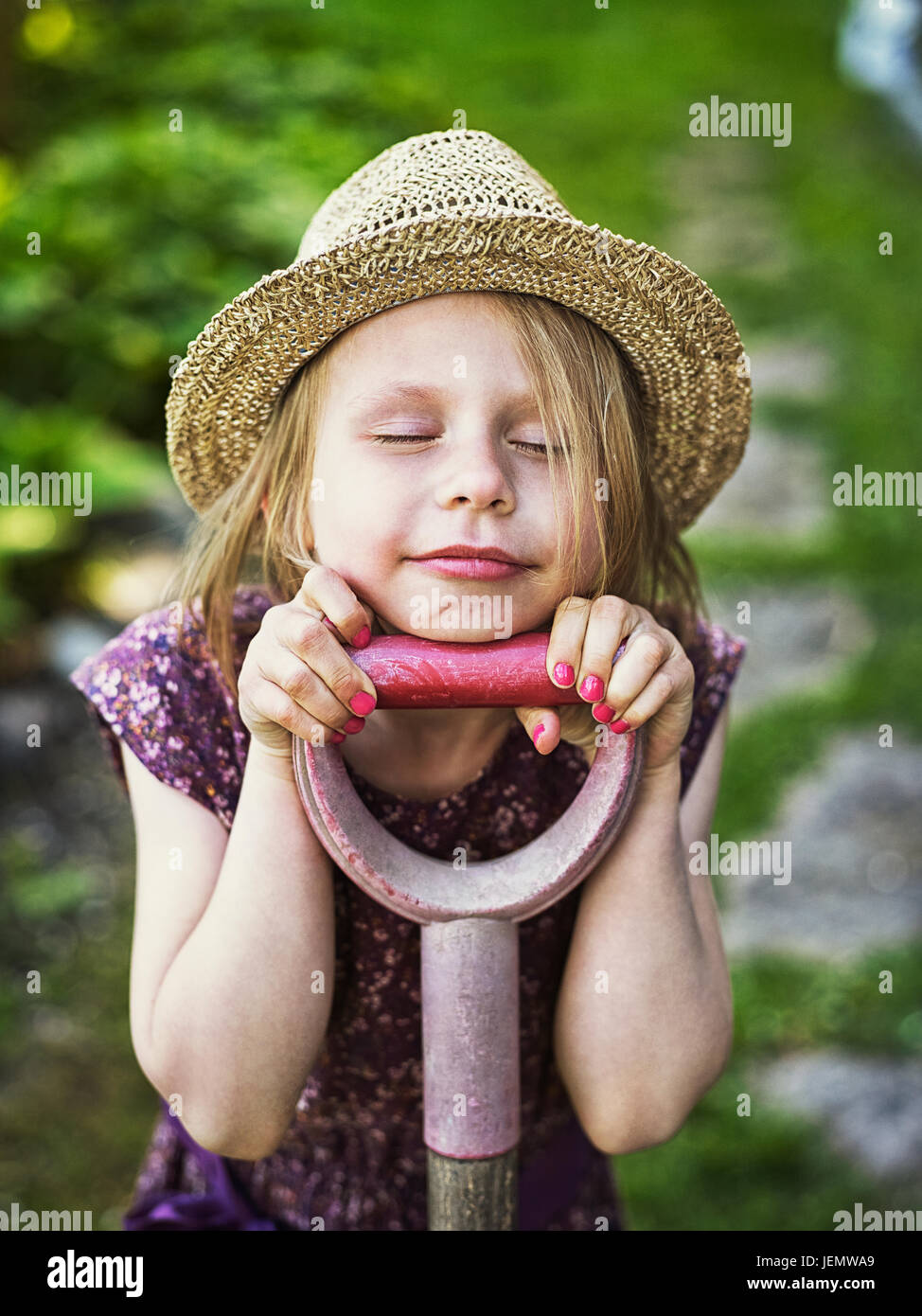 Smiling girl wearing straw hat Stock Photo - Alamy