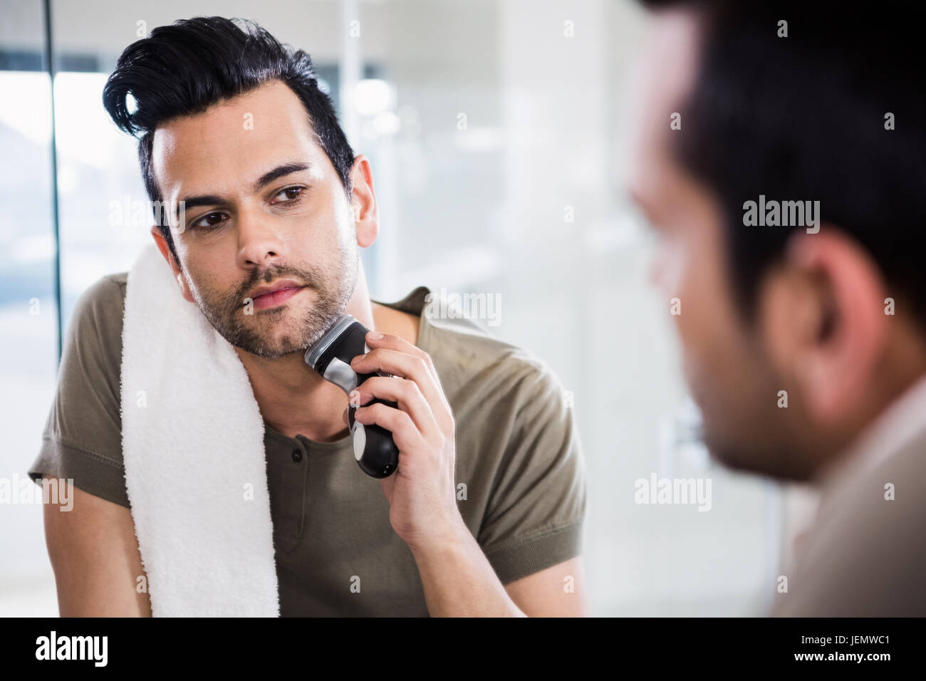 Man shaving using electric razor hi-res stock photography and images ...