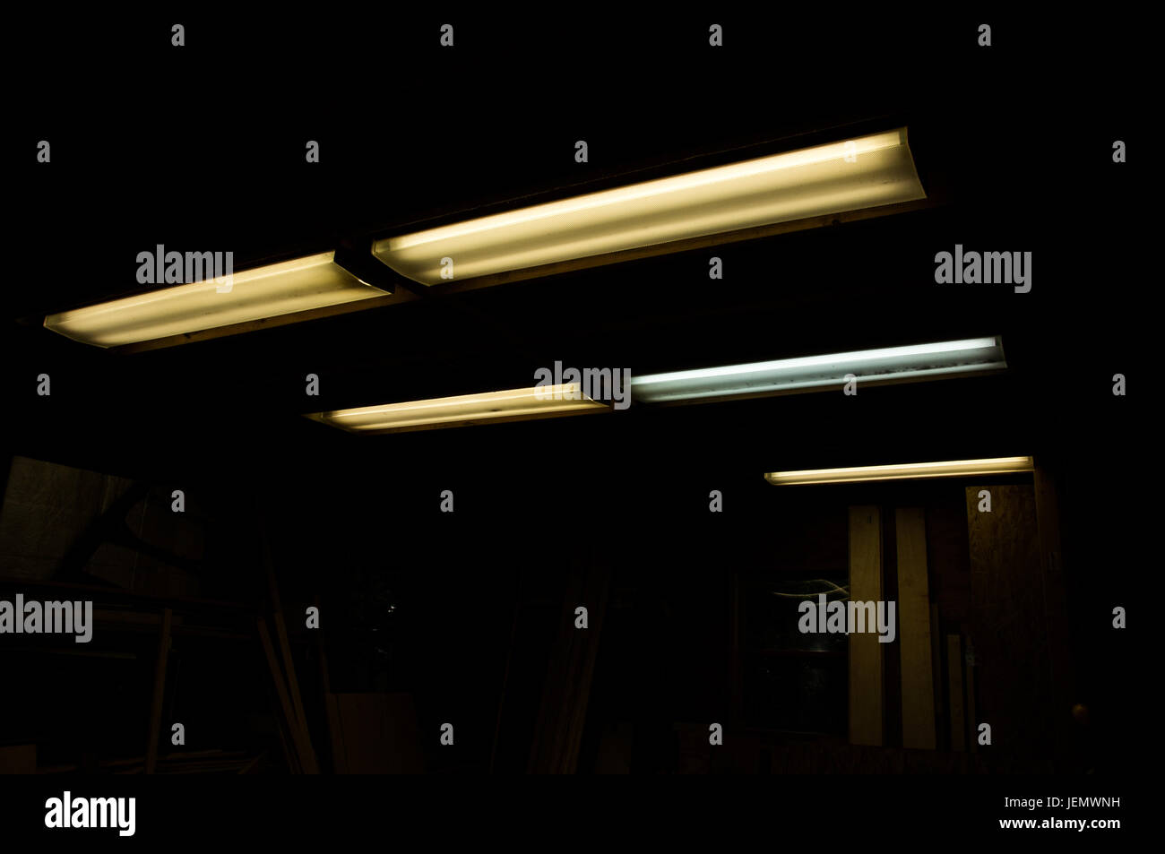In a dark workshop with lights on at night Stock Photo - Alamy