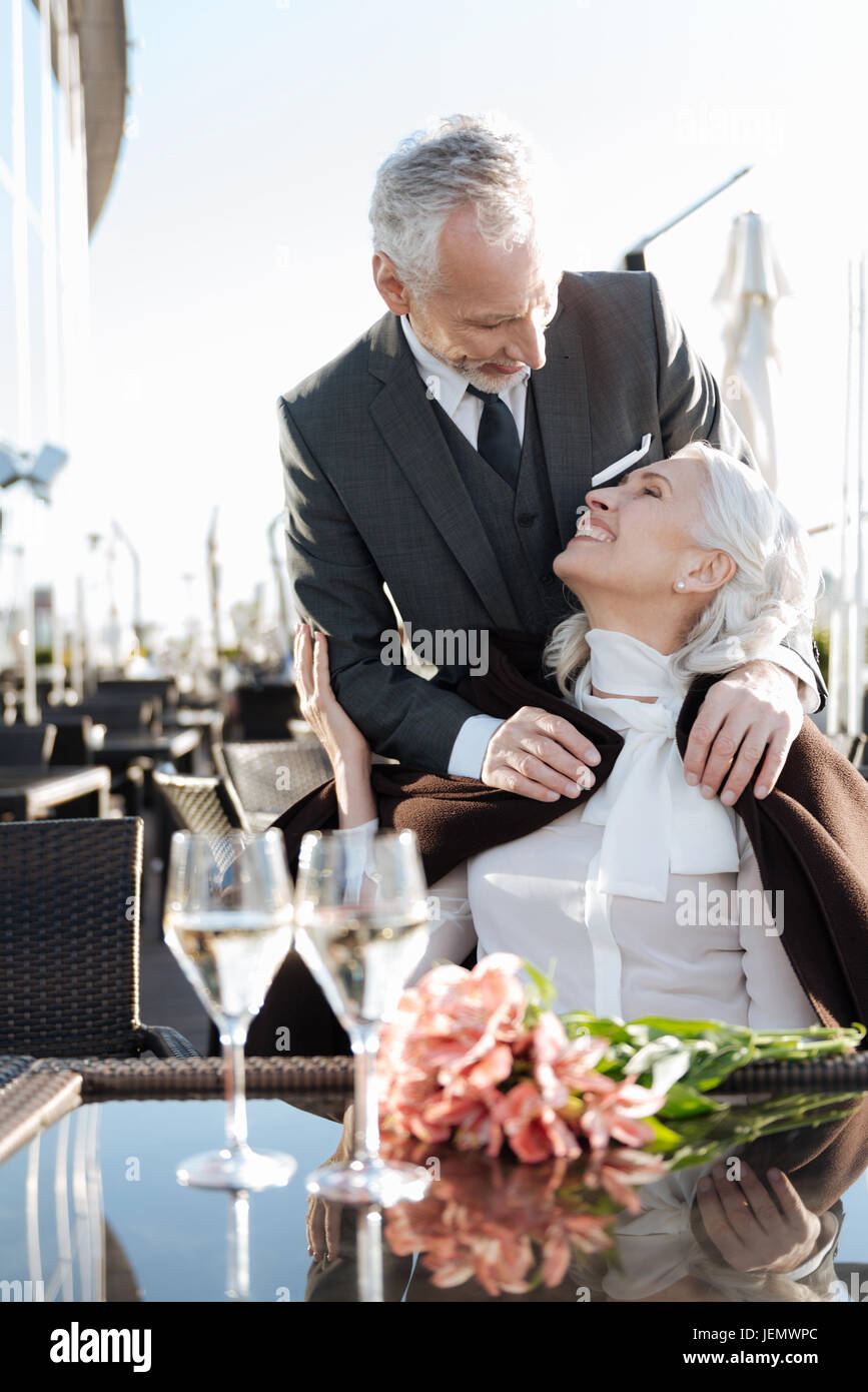 Vertical photo of delighted couple that enjoying the moment Stock Photo ...