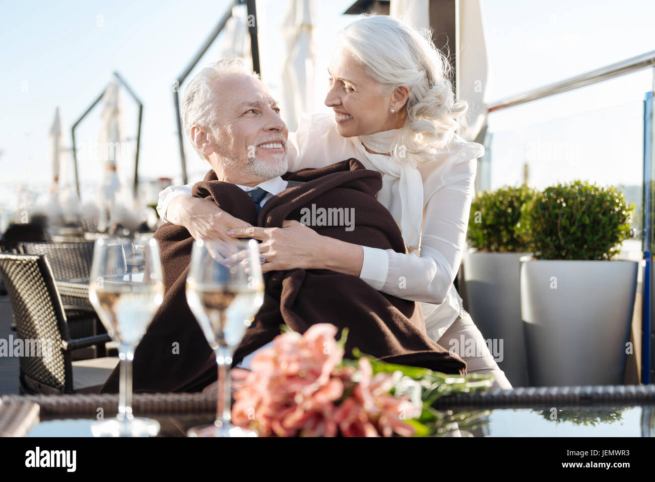 Positive woman that standing behind her man Stock Photo - Alamy