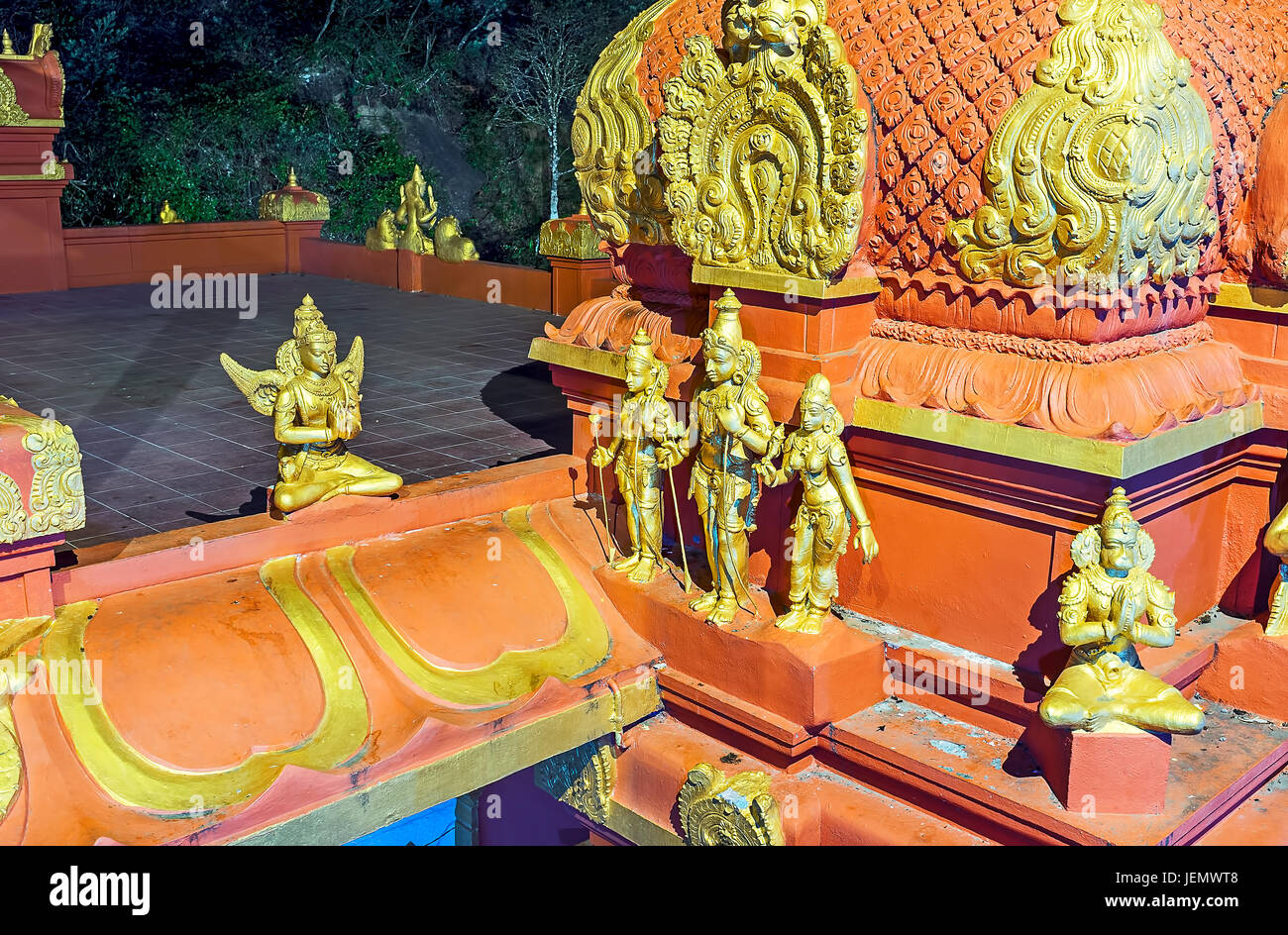 The sculptures of Hindu deities and complex relief patterns, covered ...