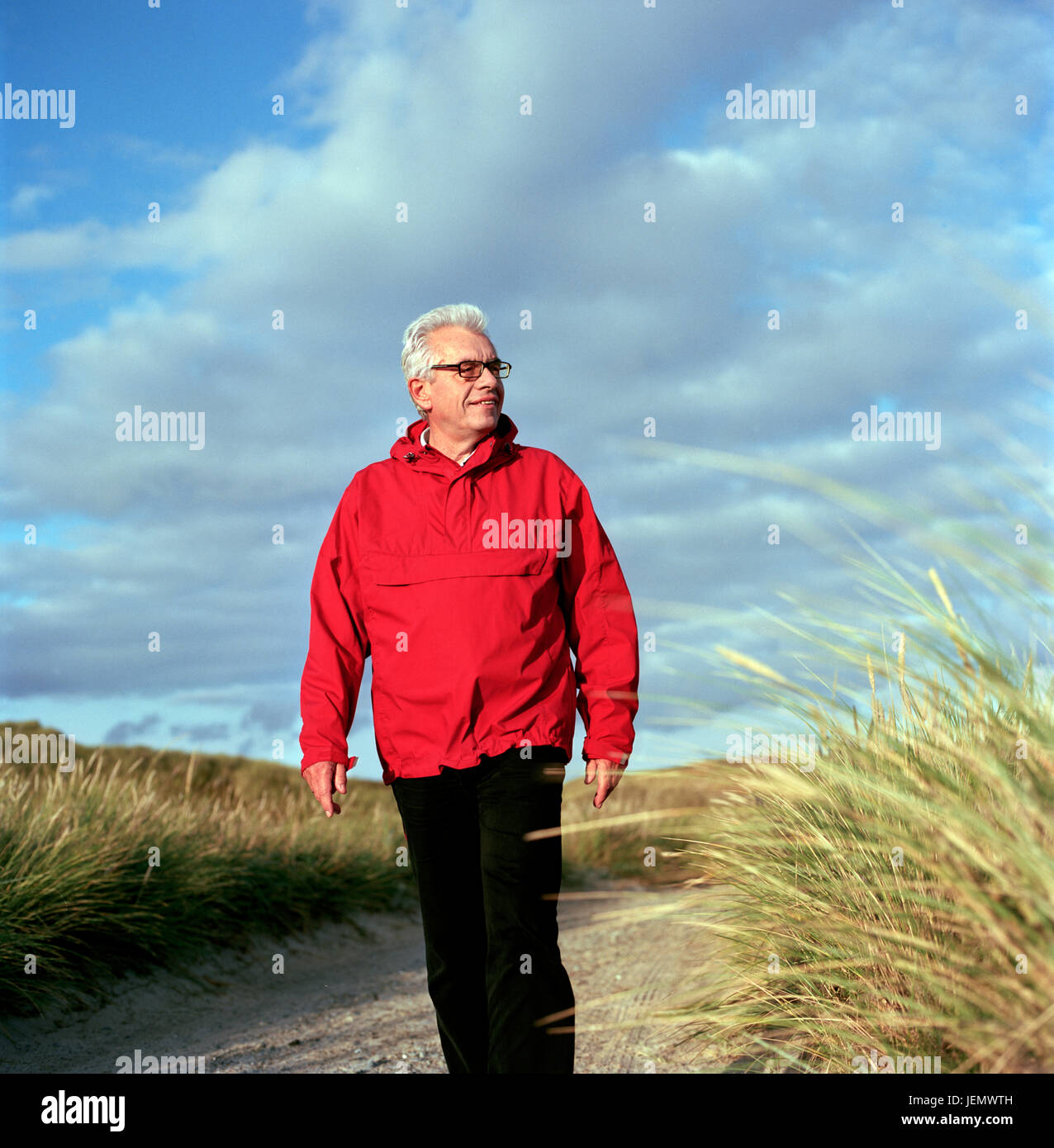 Senior man walking Stock Photo - Alamy