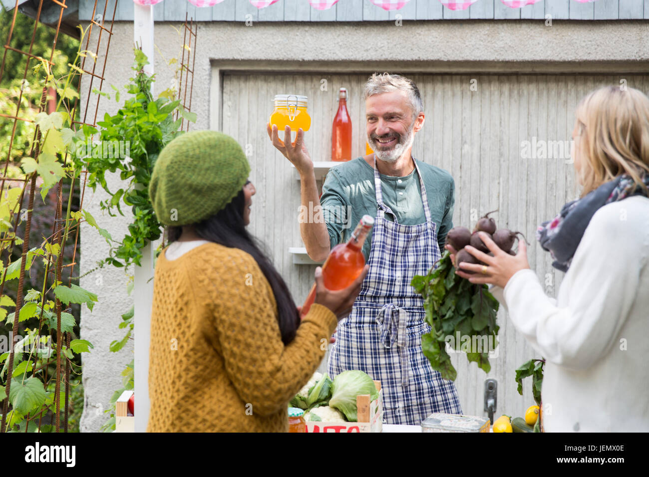 People looking at home-made products Stock Photo - Alamy