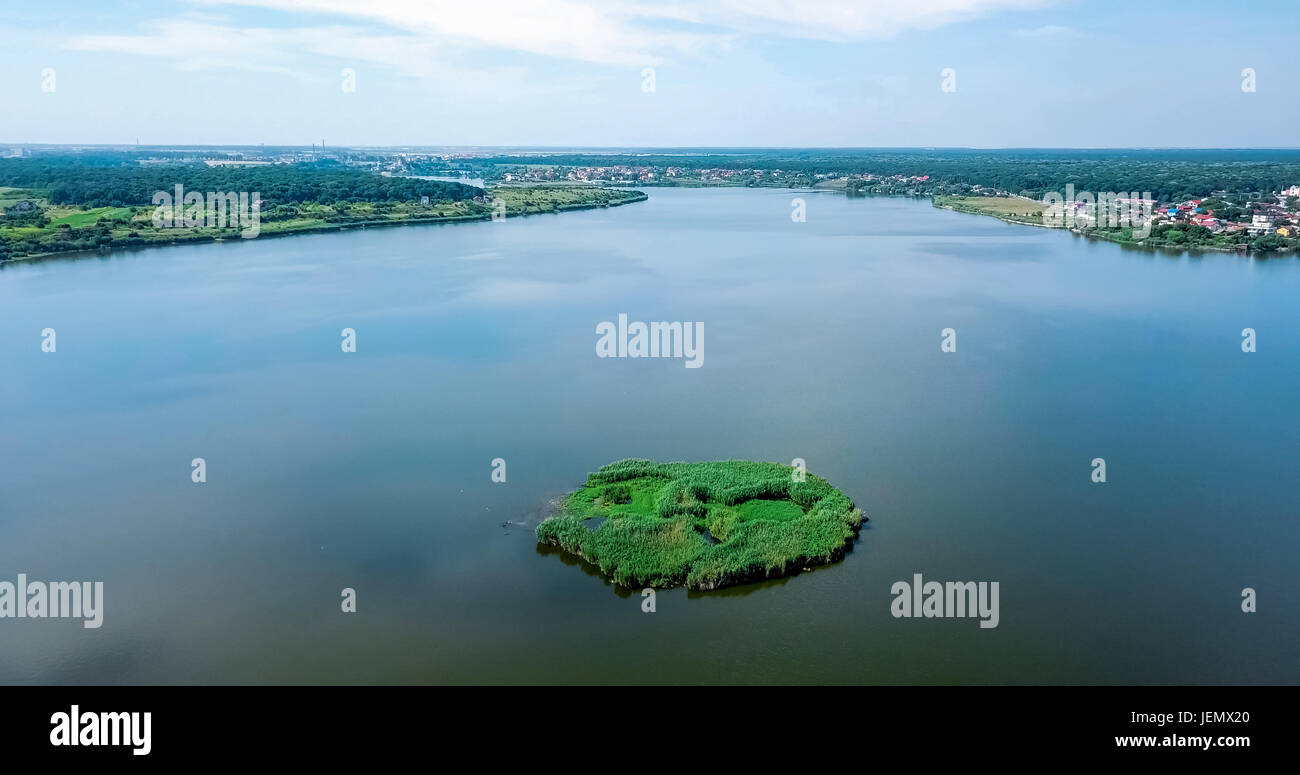 Aerial Drone View Of Small Green Island Lake On Blue Sky In Summer ...