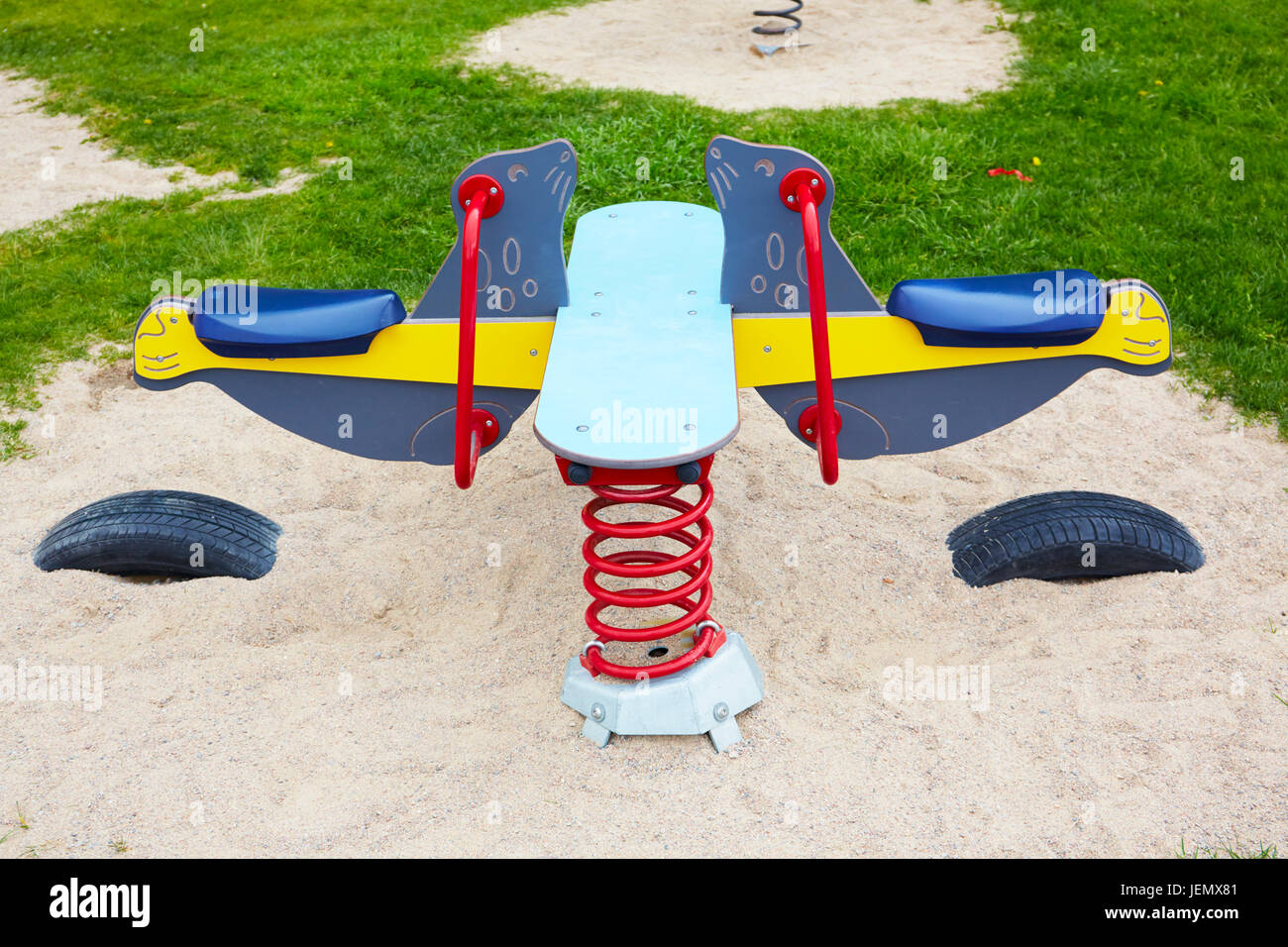 Spring seesaw in playground Stock Photo - Alamy