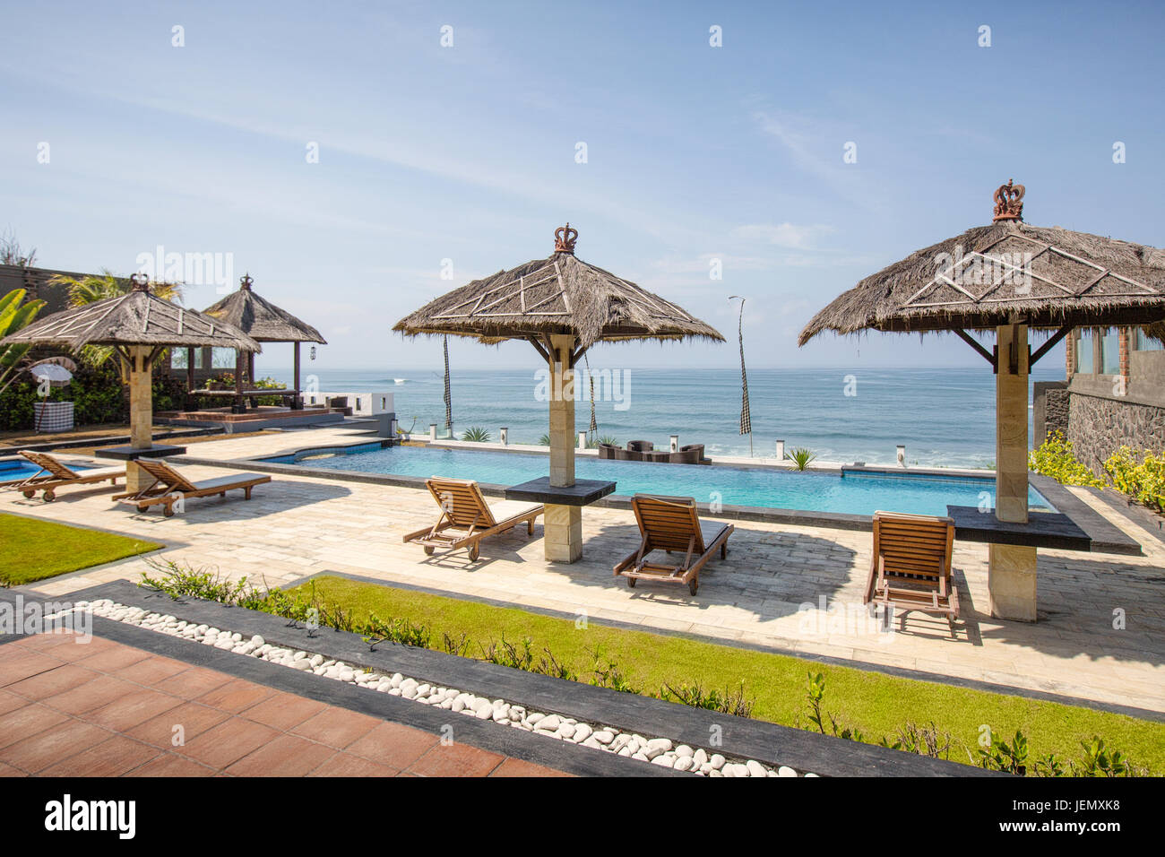 Sun chairs at swimming-pool Stock Photo - Alamy