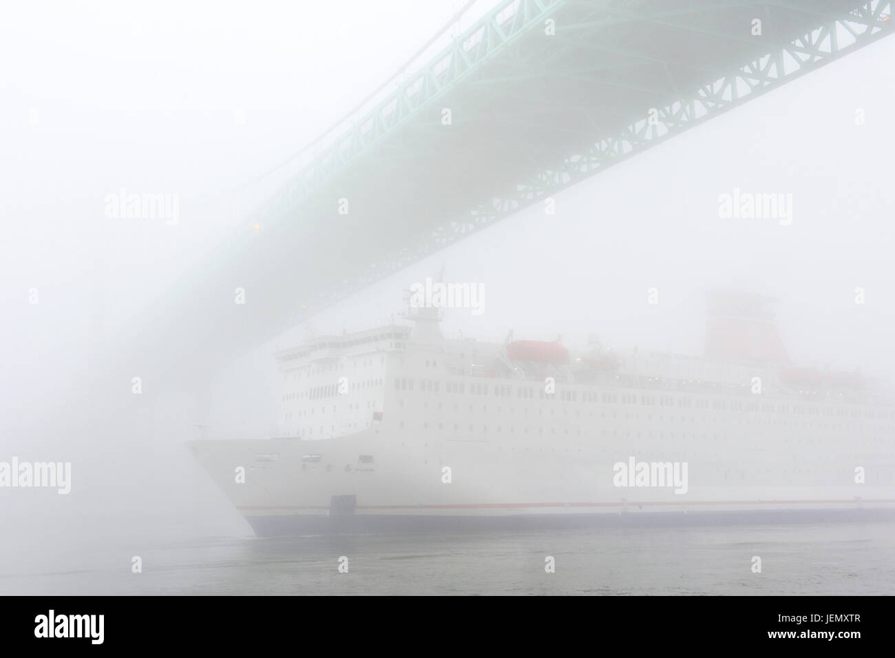 Bridge and boat in fog Stock Photo - Alamy