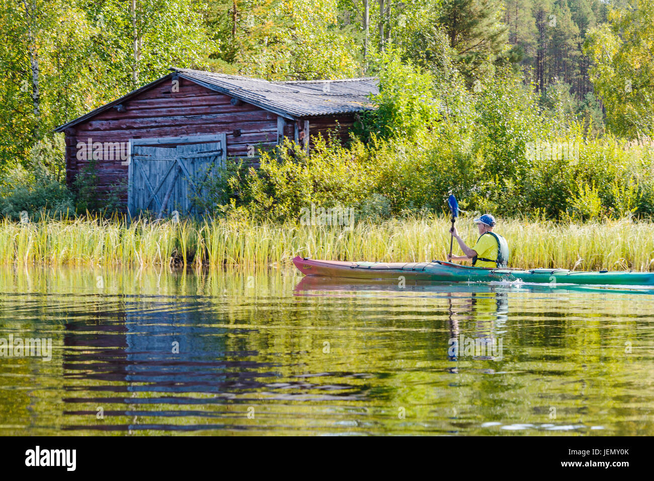 Man rowing on lake Stock Photo - Alamy