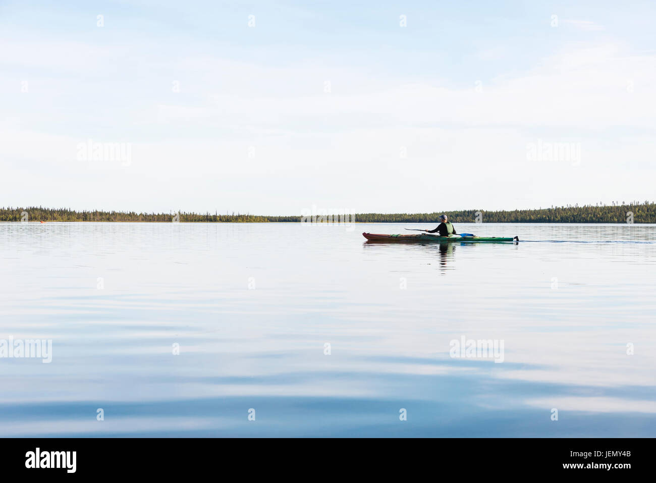 Man rowing on lake Stock Photo - Alamy