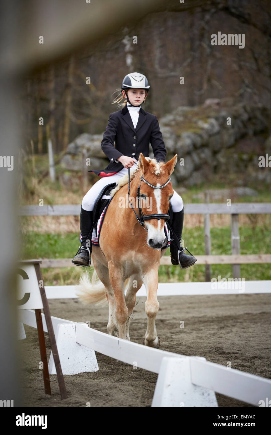 Girl horseback riding Stock Photo - Alamy