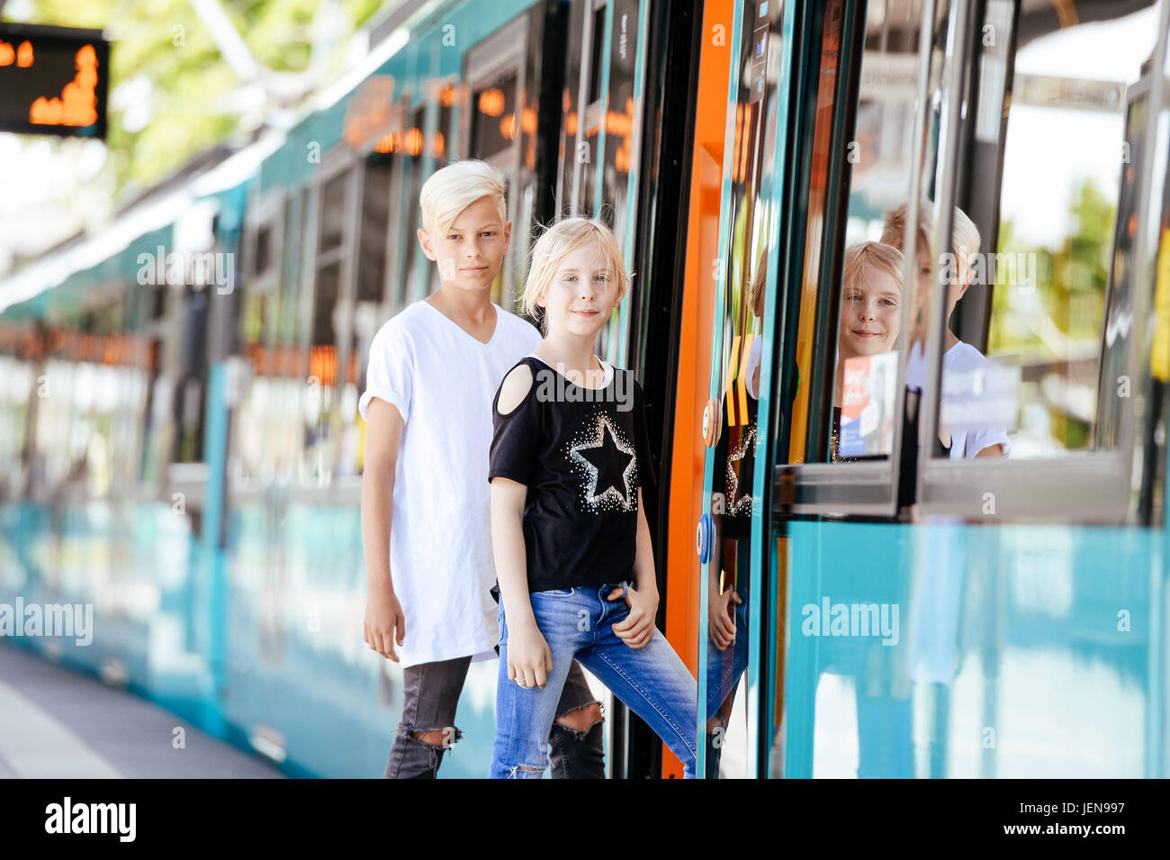 A boy and a girl get into a subway, taken on 16/07/17 in Frankfurt ...