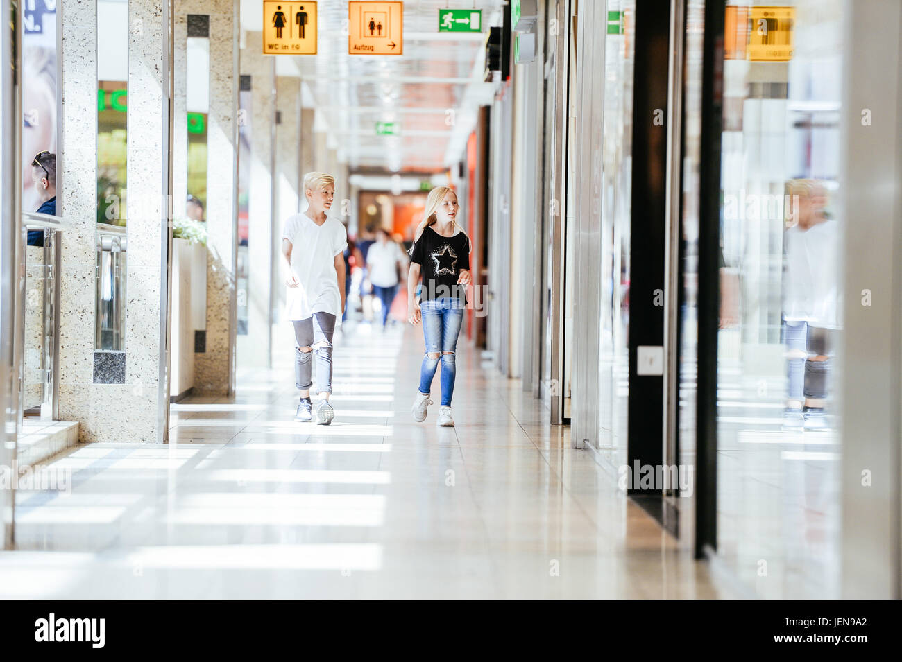 A boy and a girl run through a shopping mall, taken on 16/06/17 in ...
