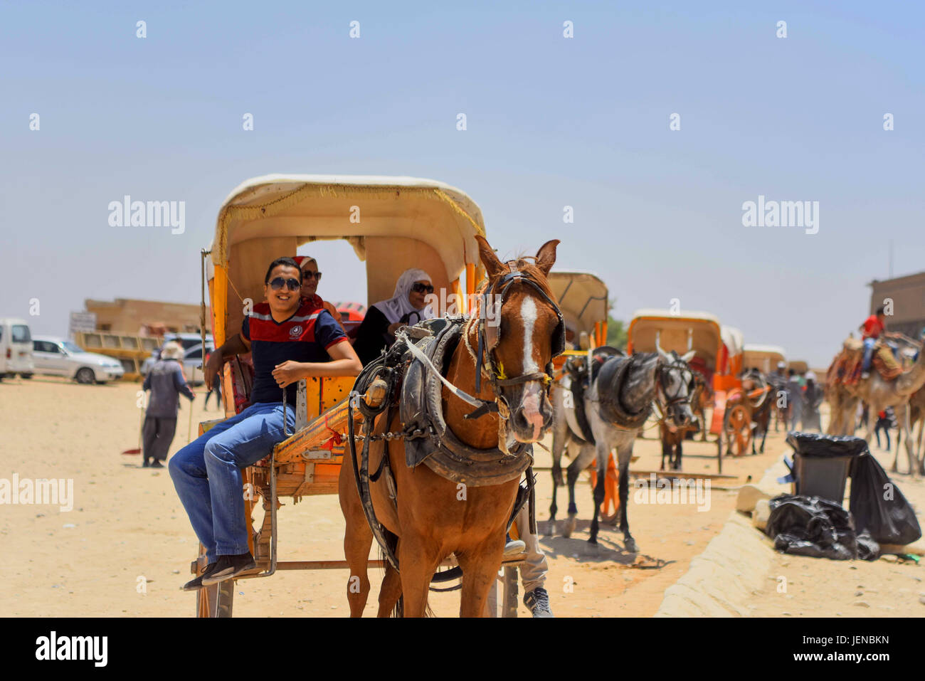 Cairo, Egypt. 27th June, 2017. Egyptians ride horse carts in front of ...