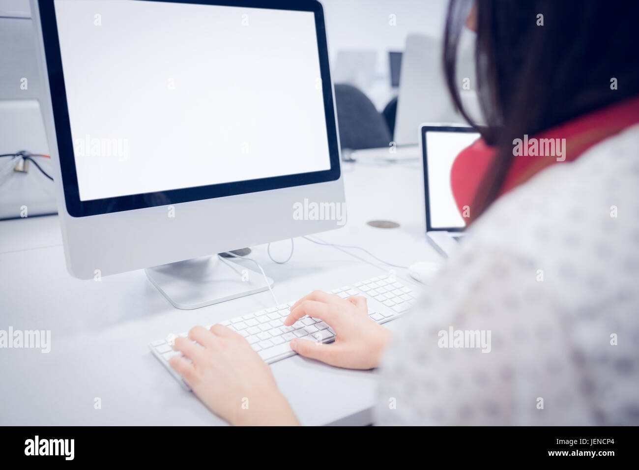 Rear view of student using computer Stock Photo - Alamy
