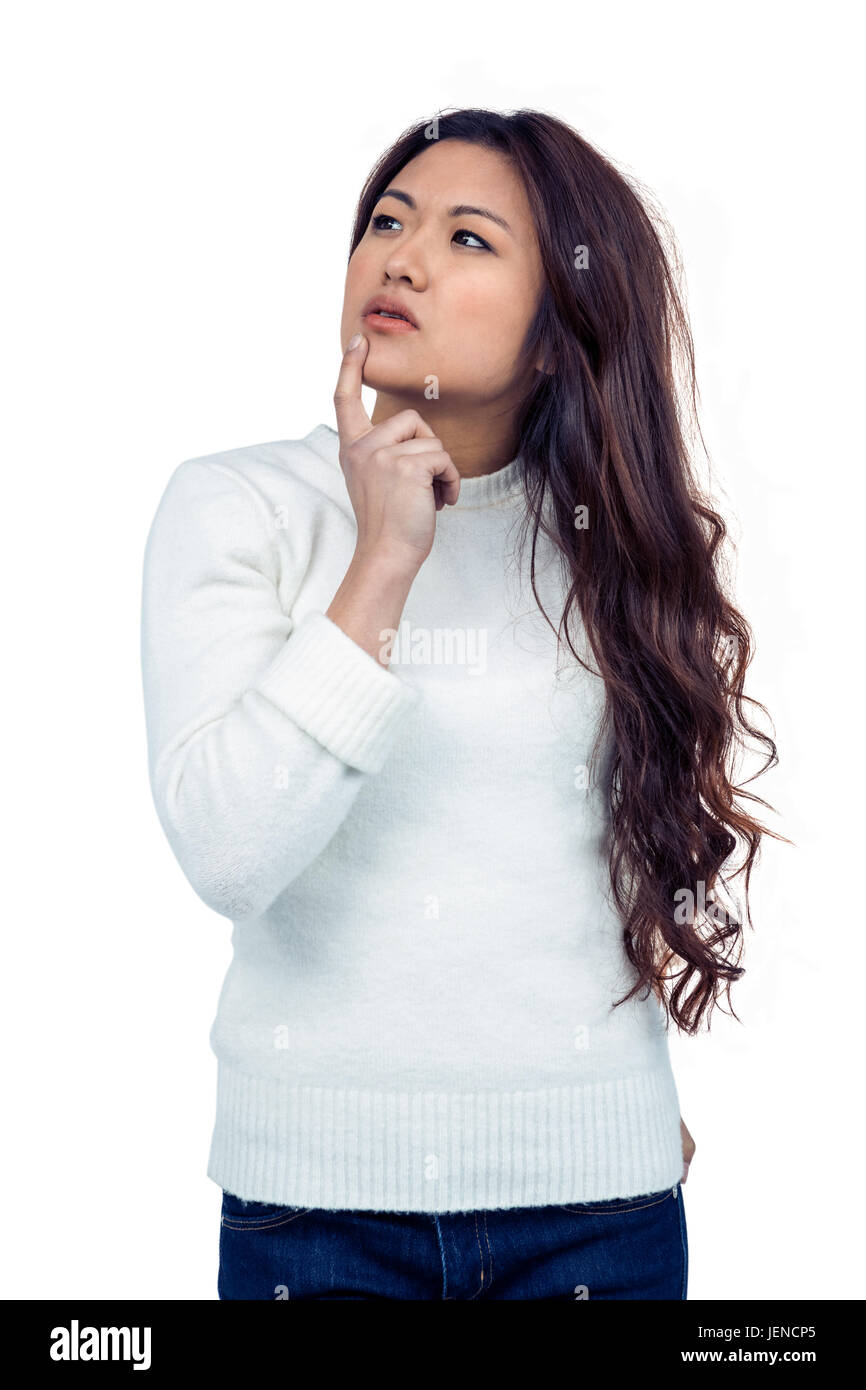 Thoughtful Asian woman with finger on chin Stock Photo - Alamy