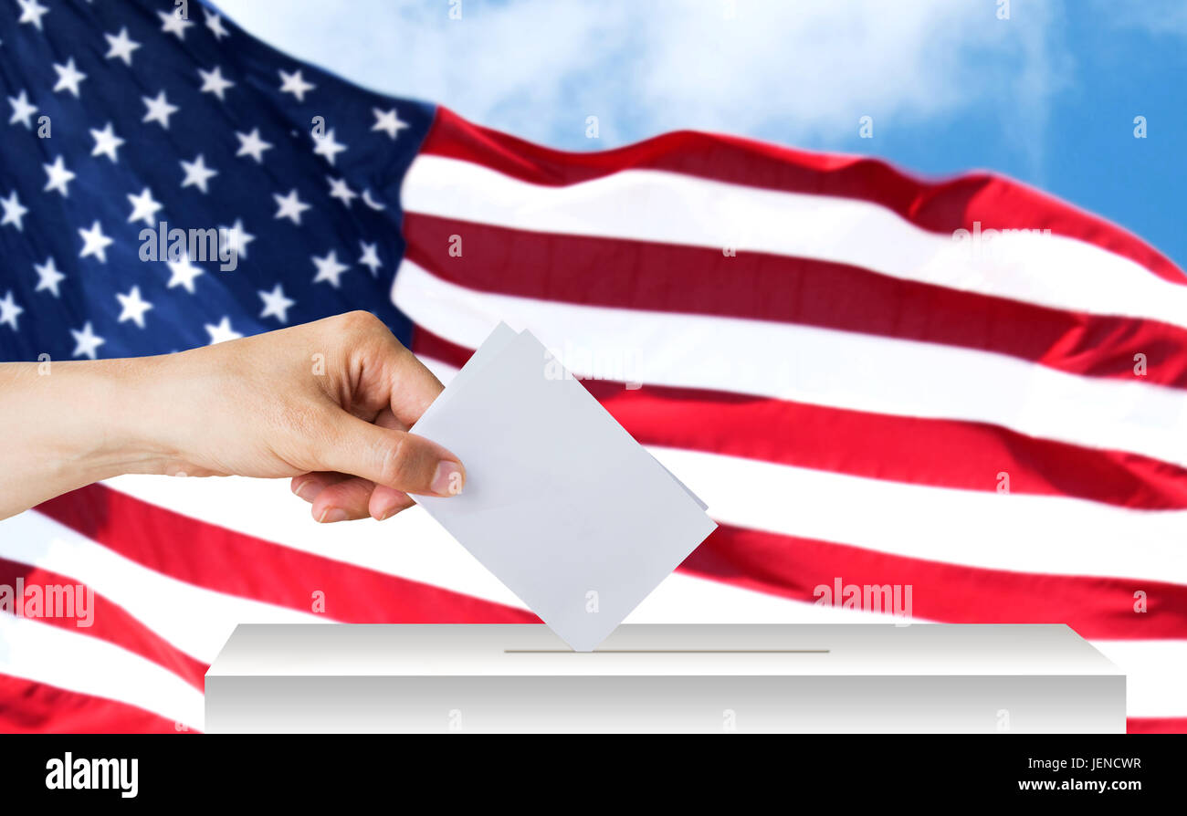 Hand putting paper ballot box hi-res stock photography and images - Alamy