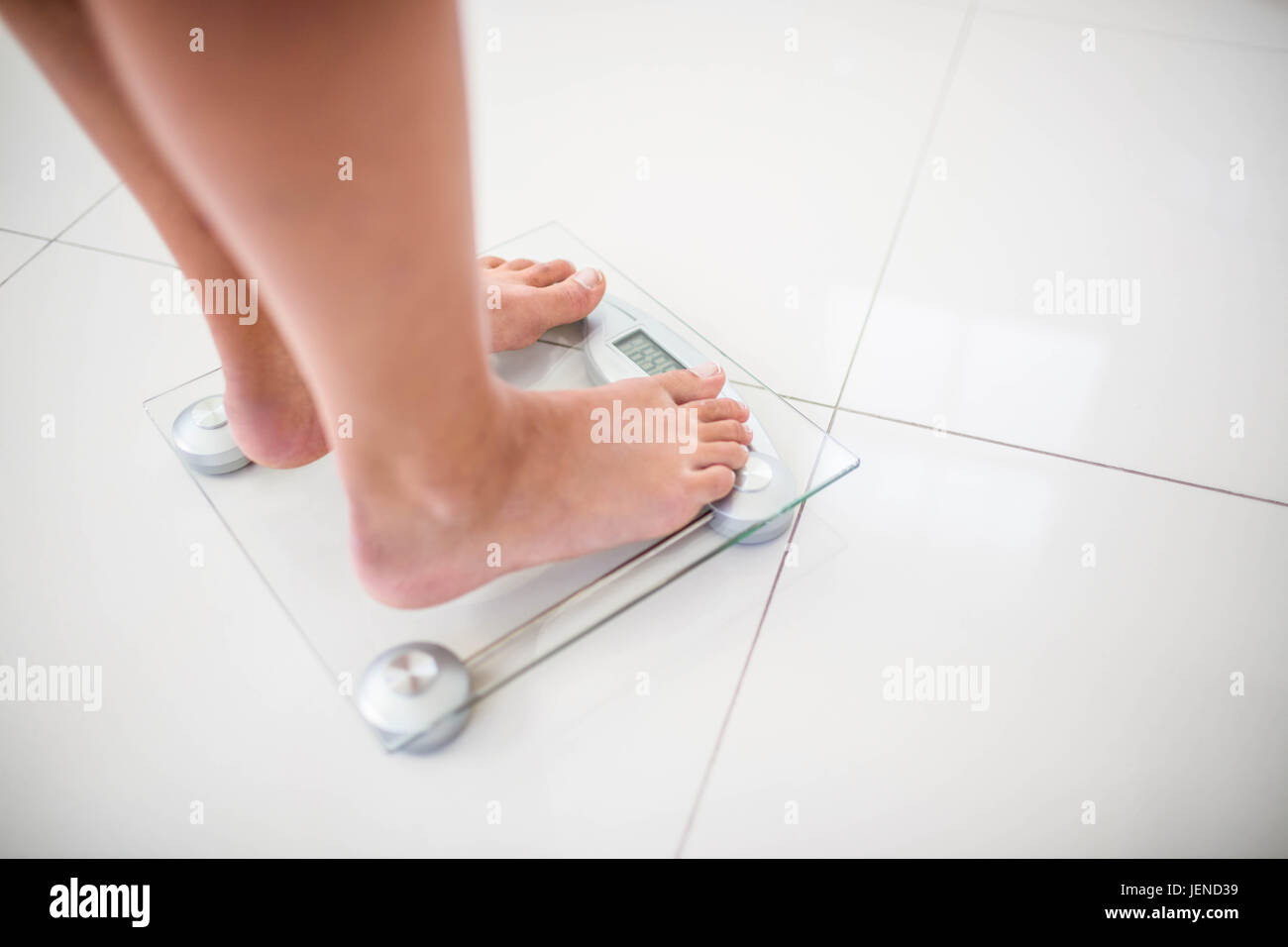 Female feet on weighing scale hi-res stock photography and images - Alamy
