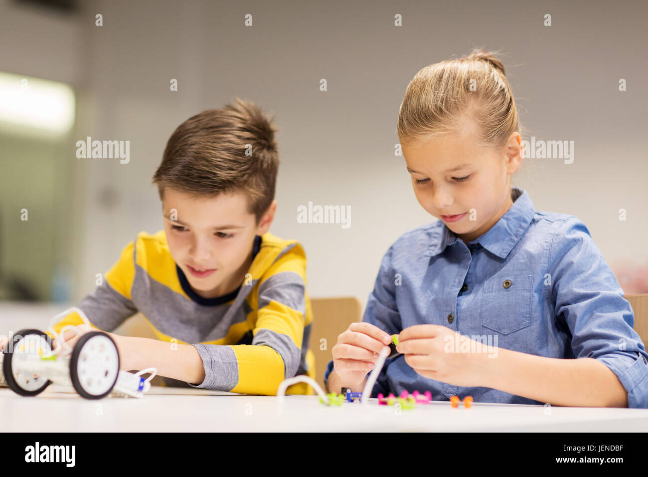 happy children building robots at robotics school Stock Photo - Alamy