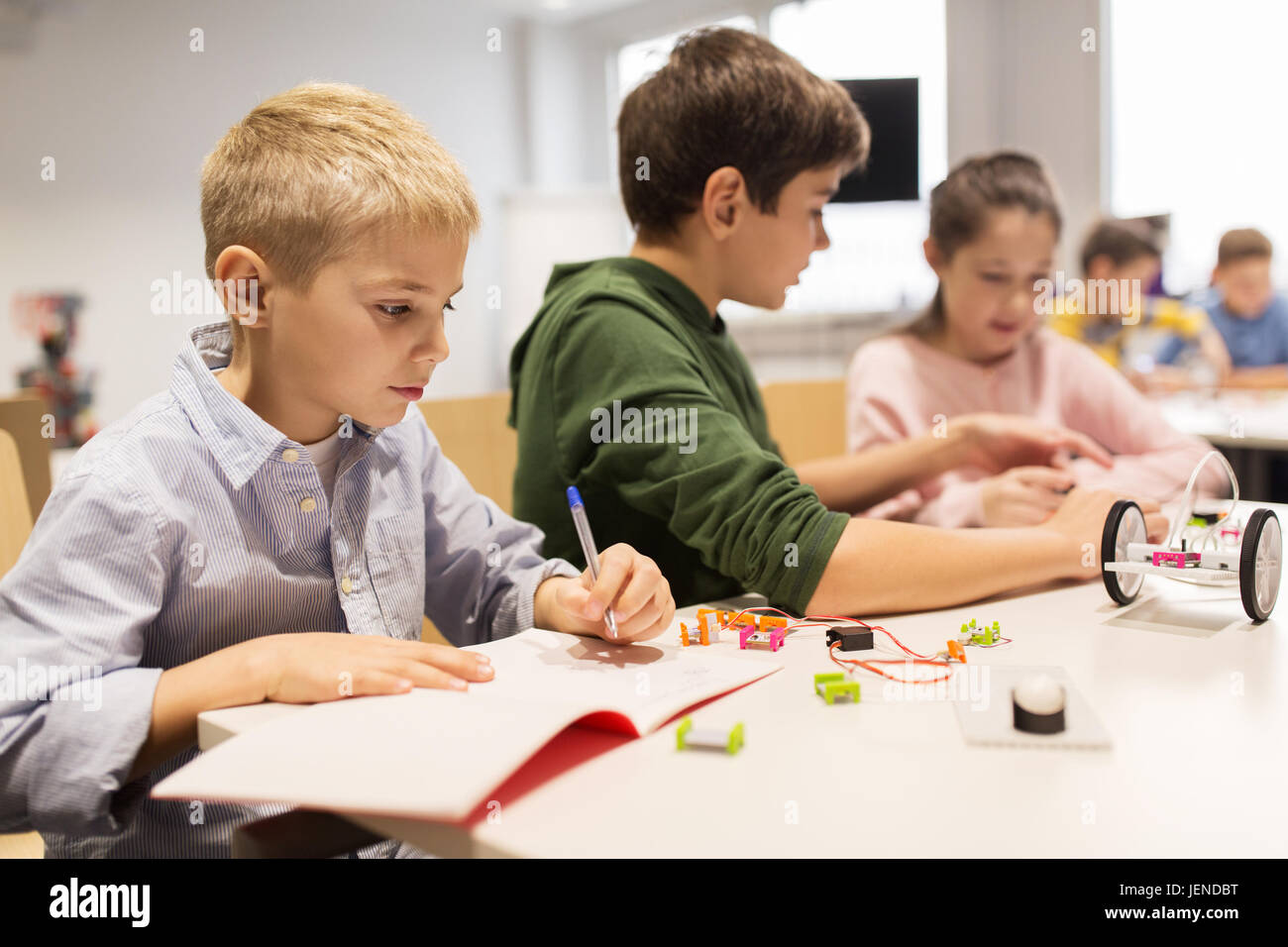 happy children building robots at robotics school Stock Photo - Alamy