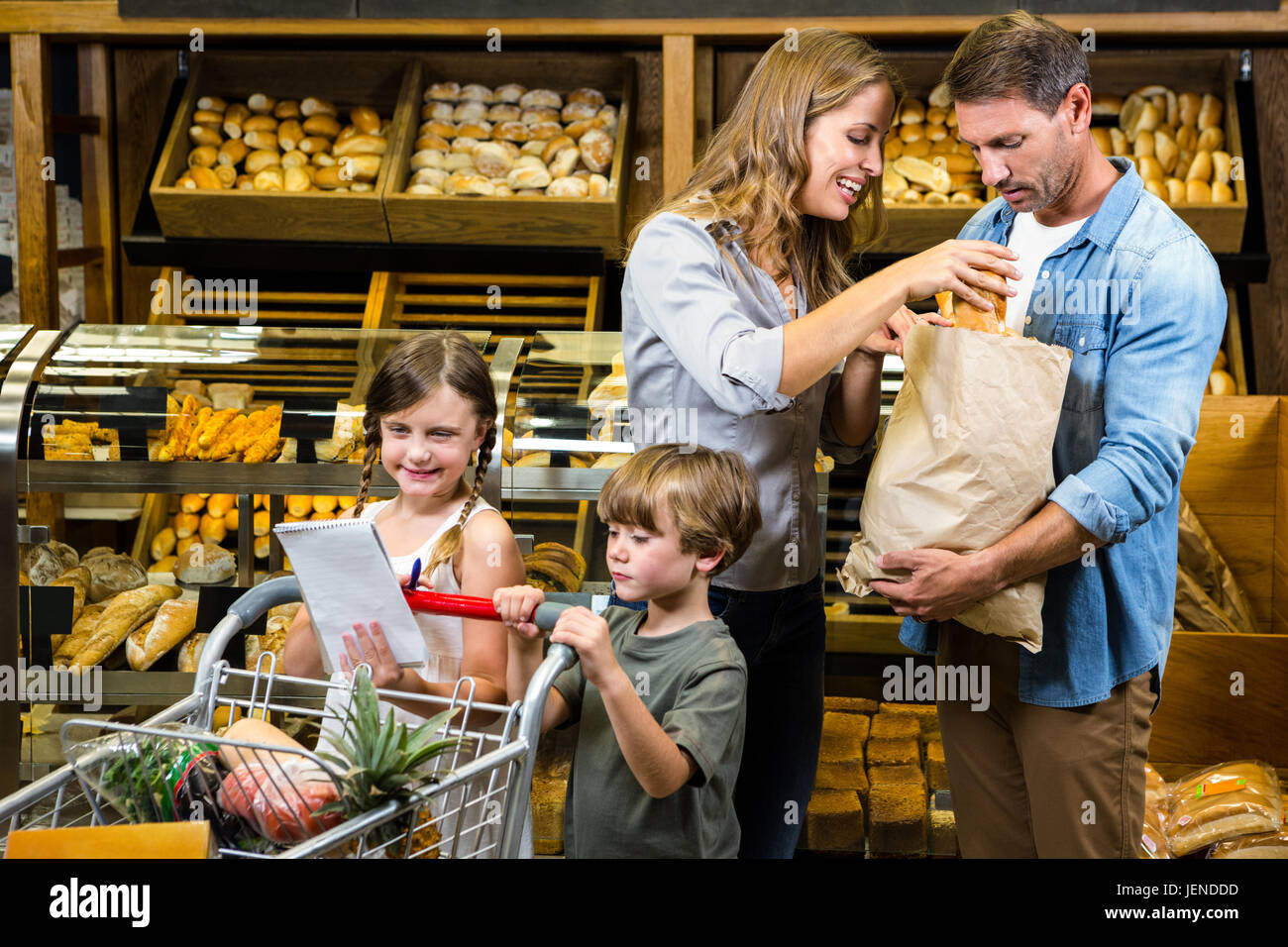 Happy family doing shopping Stock Photo - Alamy