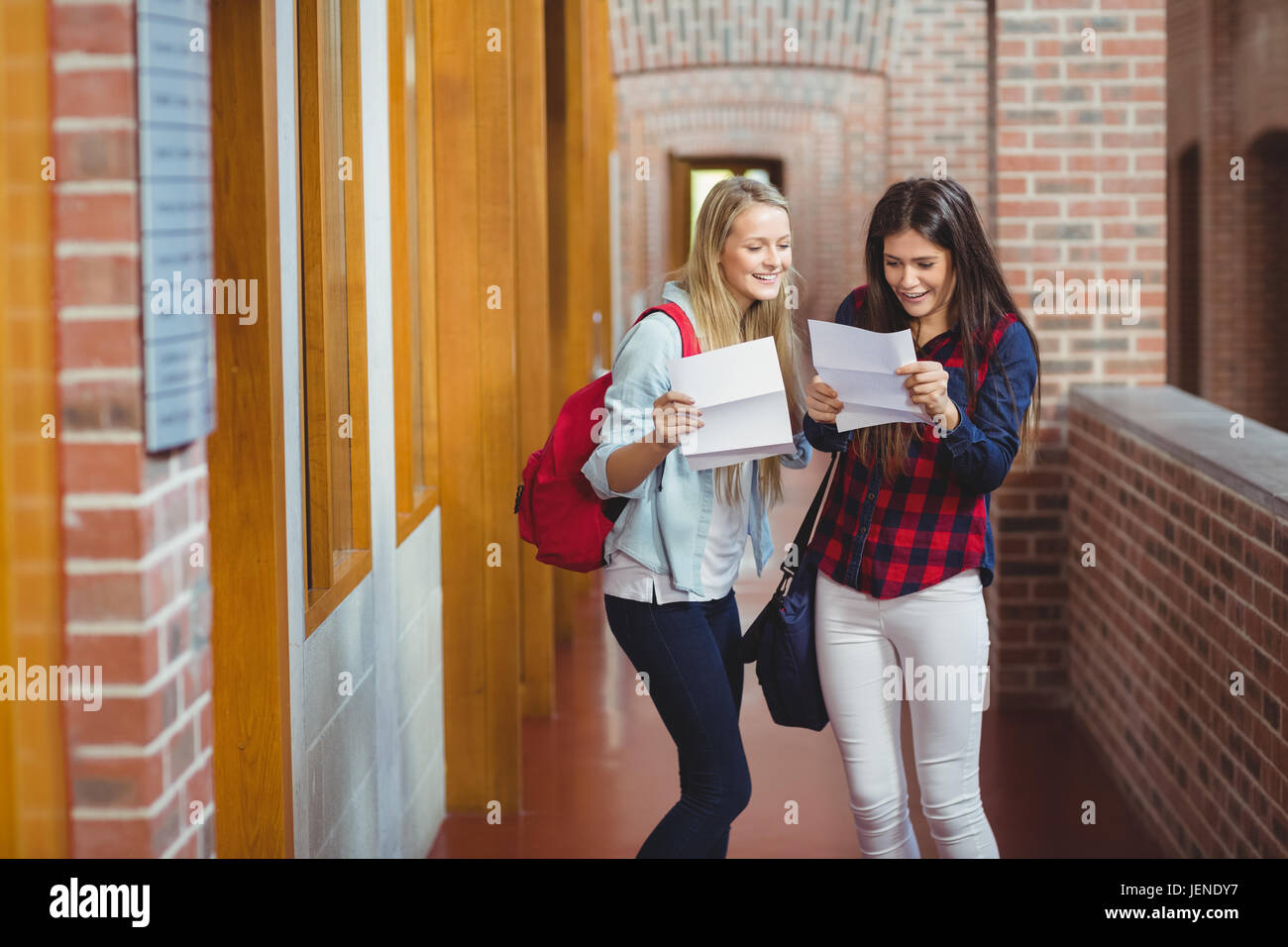 Smiling students looking at results Stock Photo - Alamy