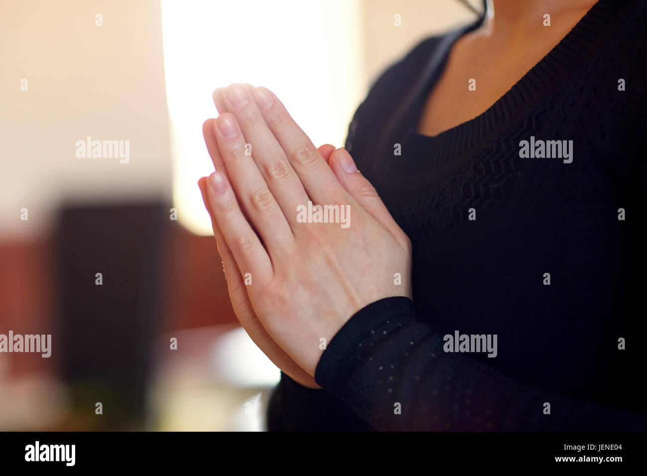 close up of sad woman praying god in church Stock Photo - Alamy