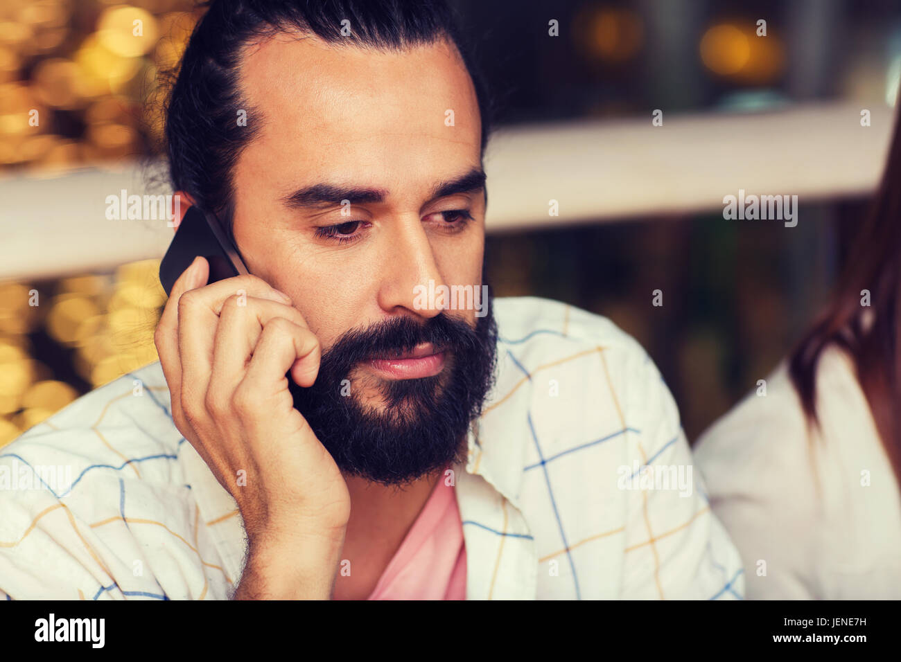 sad man calling on smartphone at restaurant Stock Photo - Alamy