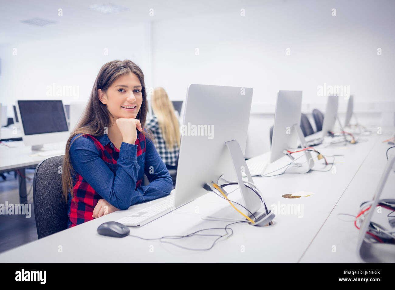 Smiling student working on computer Stock Photo - Alamy