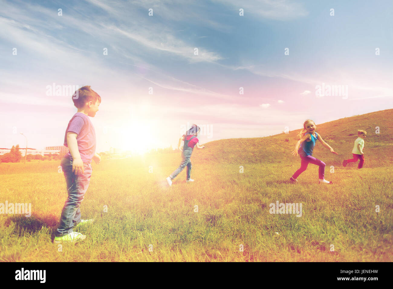 group of happy kids running outdoors Stock Photo - Alamy