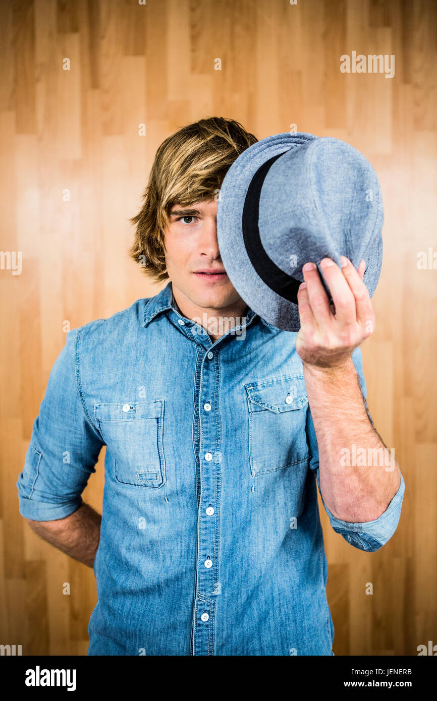 Focused hipster man hiding his face Stock Photo - Alamy