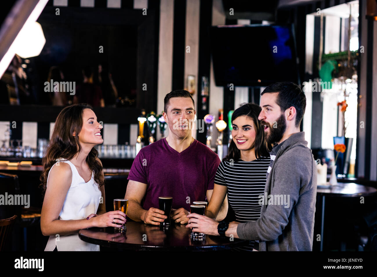 Friends having a pint Stock Photo - Alamy