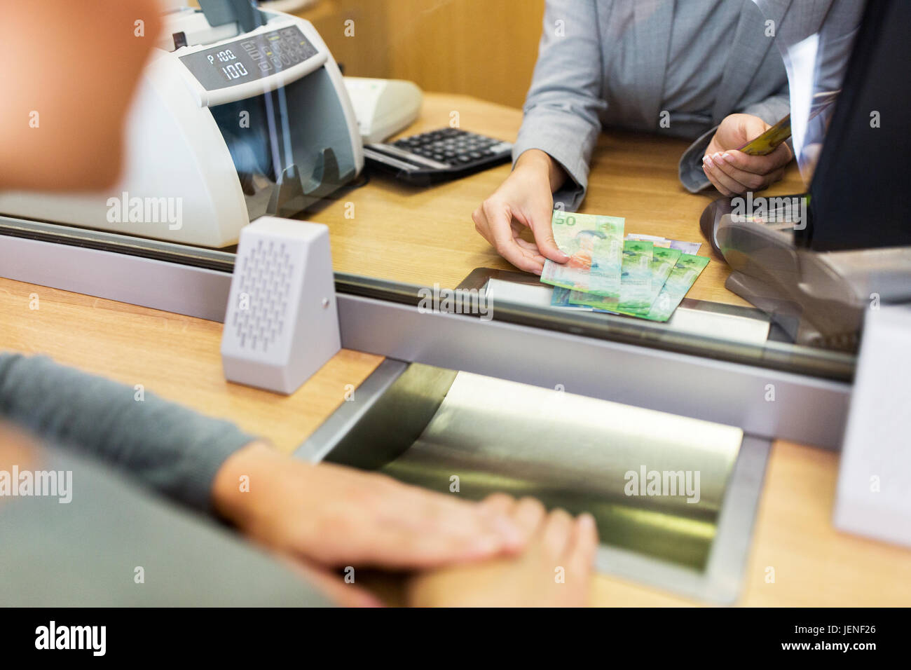 clerk counting cash money at bank office Stock Photo - Alamy