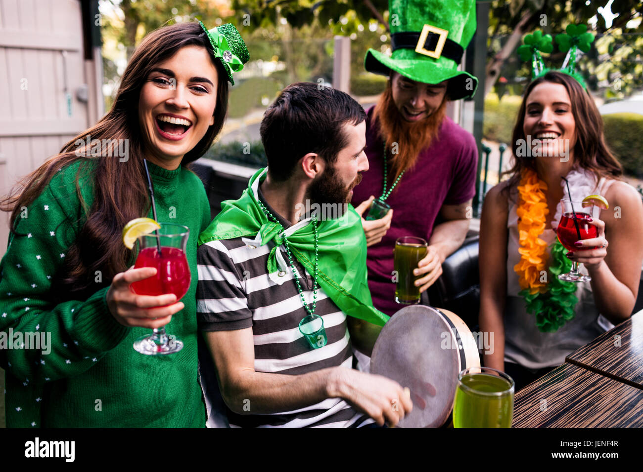 Smiling friends enjoying st hi-res stock photography and images - Alamy