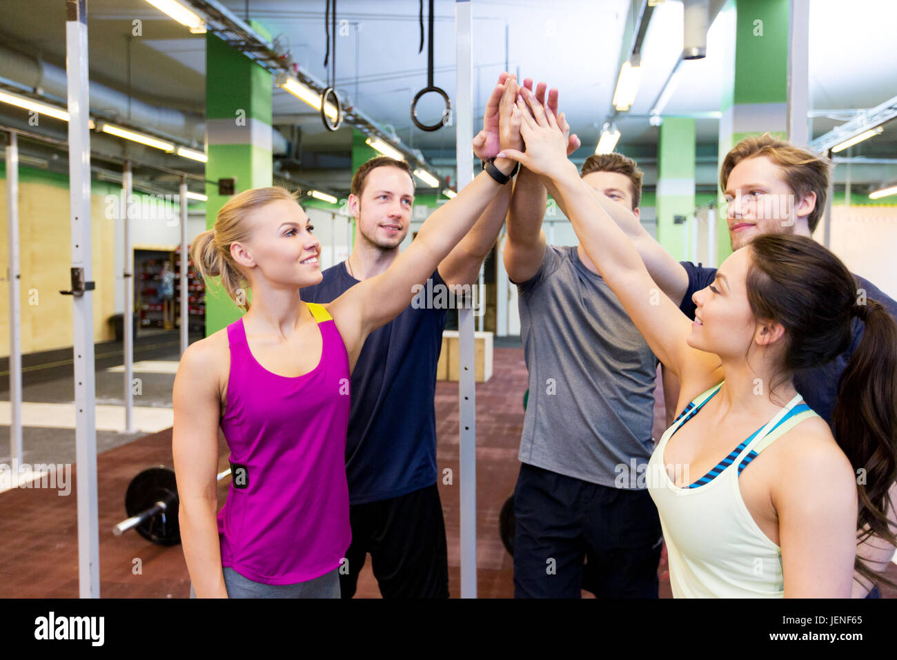 group of happy friends making high five in gym Stock Photo - Alamy