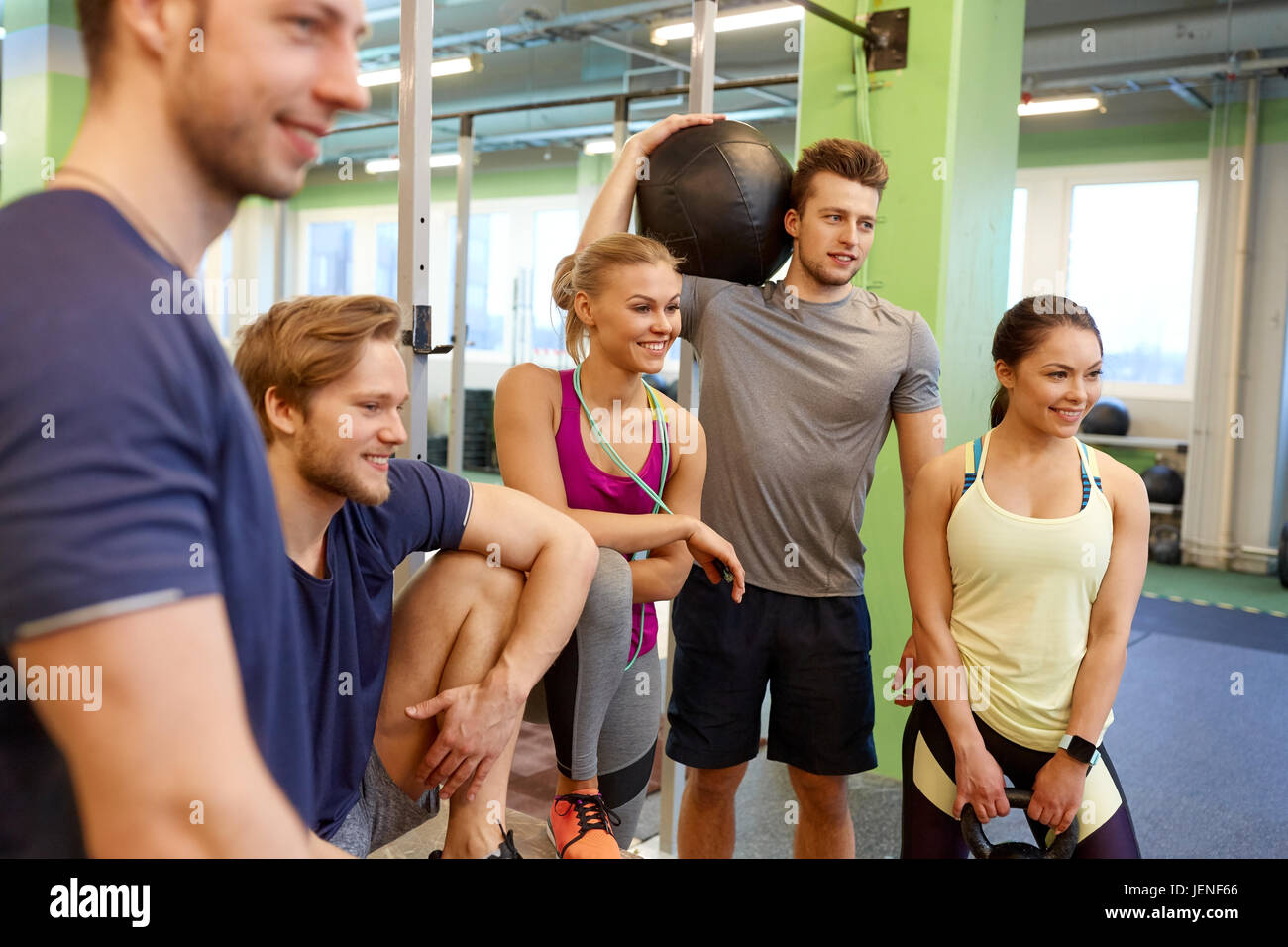 group of friends with sports equipment in gym Stock Photo - Alamy