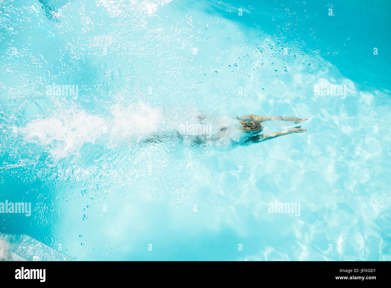 Woman diving in the pool Stock Photo - Alamy