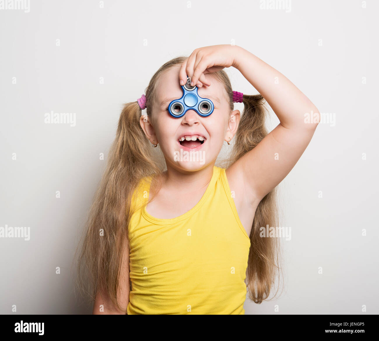 little child with a bright spinner Stock Photo - Alamy