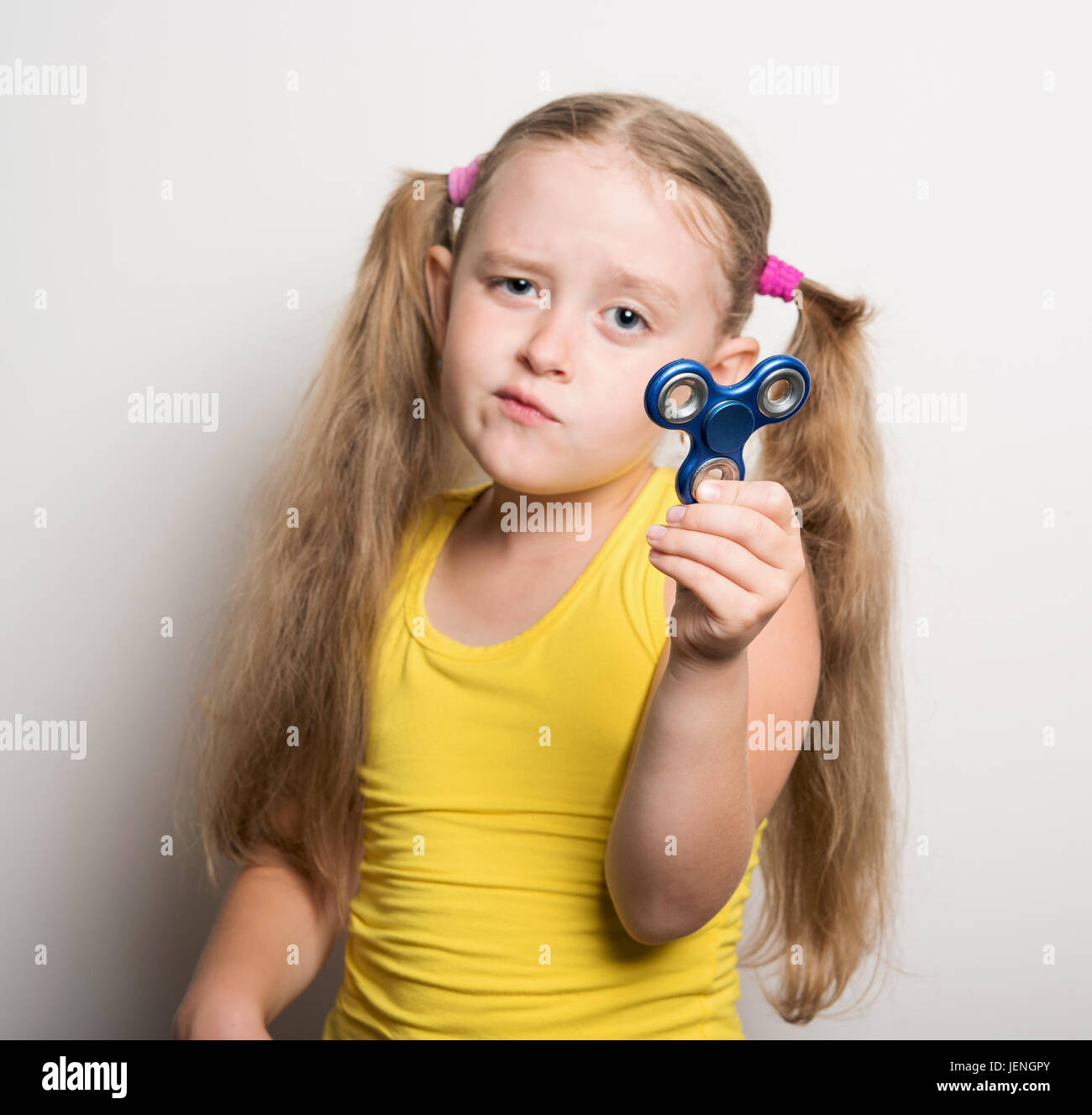 little girl with a bright spinner Stock Photo - Alamy