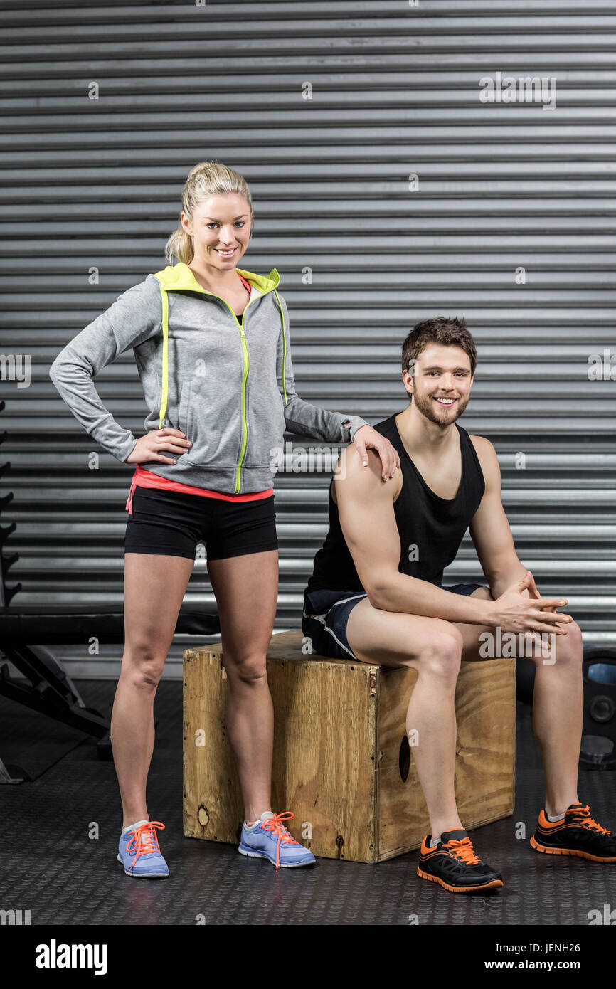 Portrait of smiling fit couple Stock Photo - Alamy