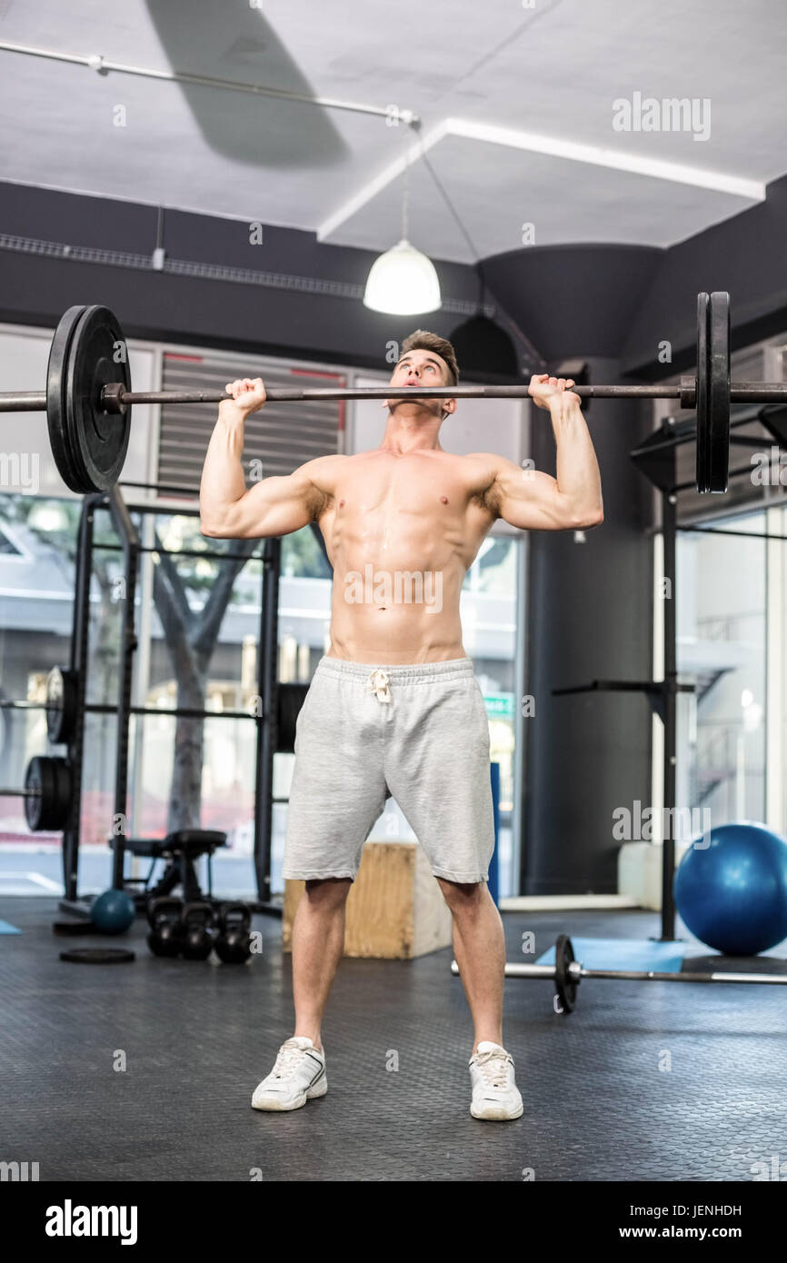 Fit man lifting barbell Stock Photo - Alamy