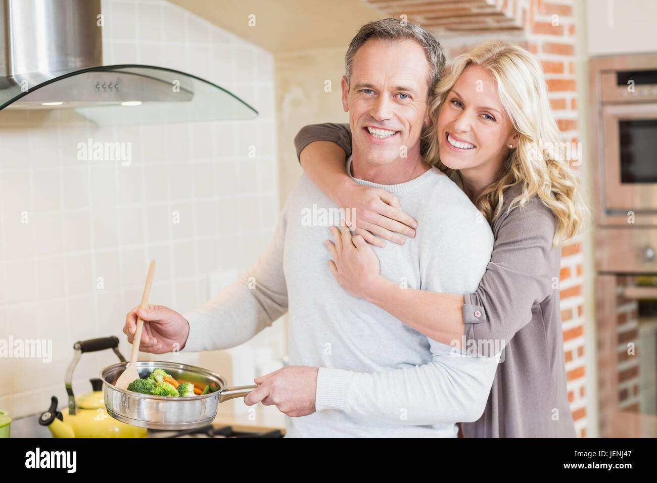 Cute couple cooking Stock Photo - Alamy