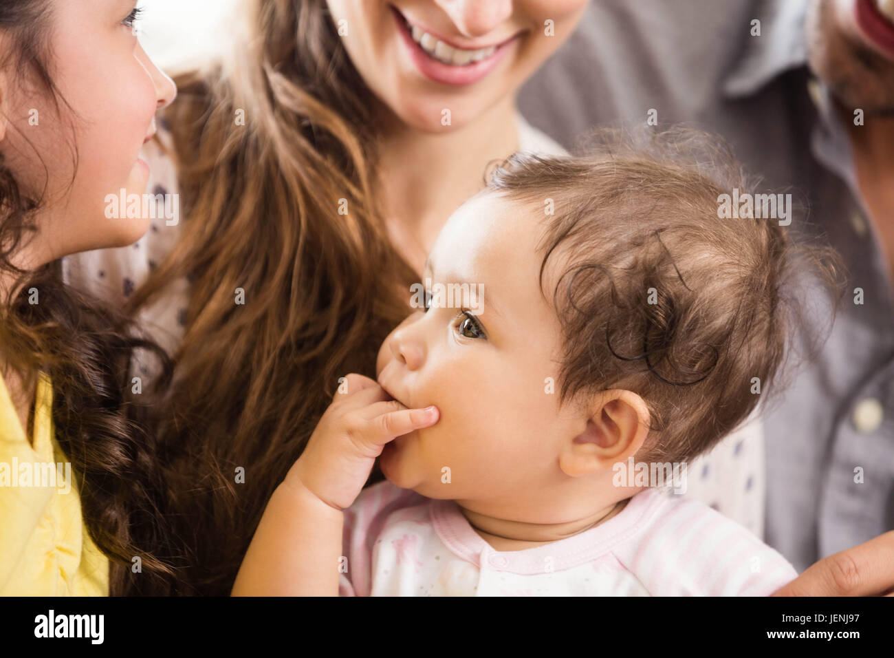 Happy extended family smiling Stock Photo - Alamy