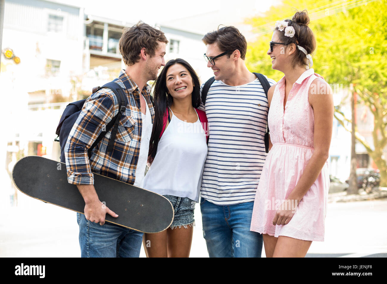 Hip friends talking Stock Photo - Alamy