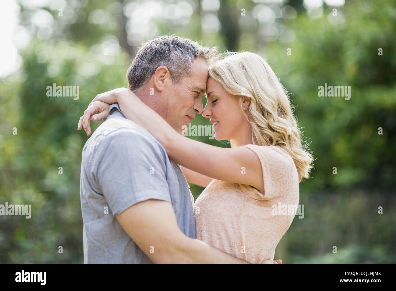 Cute couple hugging Stock Photo - Alamy