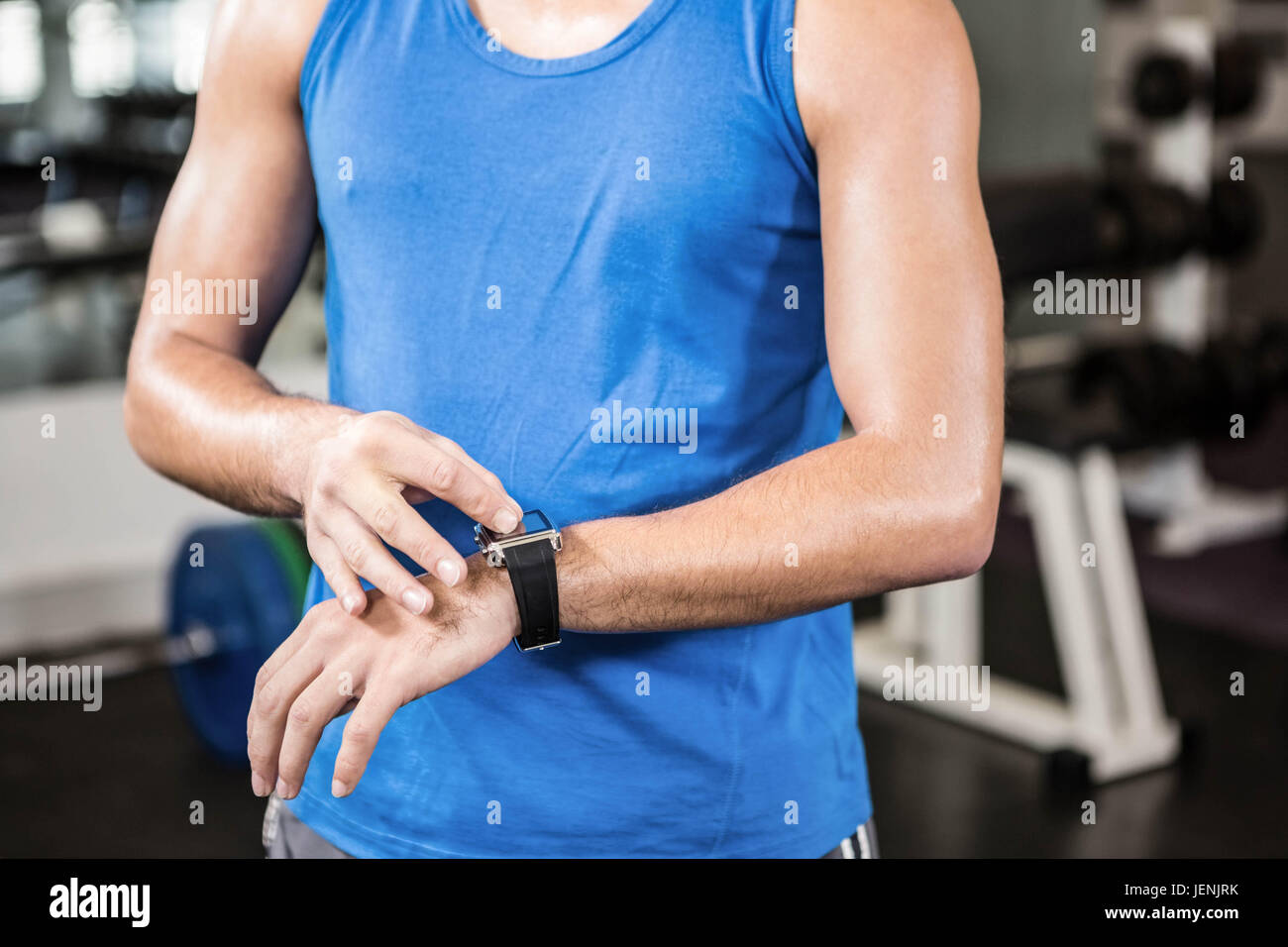 Mid section of handsome man using smartwatch Stock Photo - Alamy